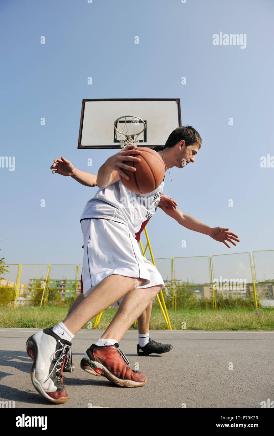 streetball basketball game with two young player at early morning on ...