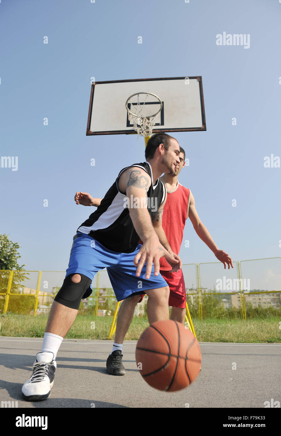 streetball basketball game with two young player at early morning on ...