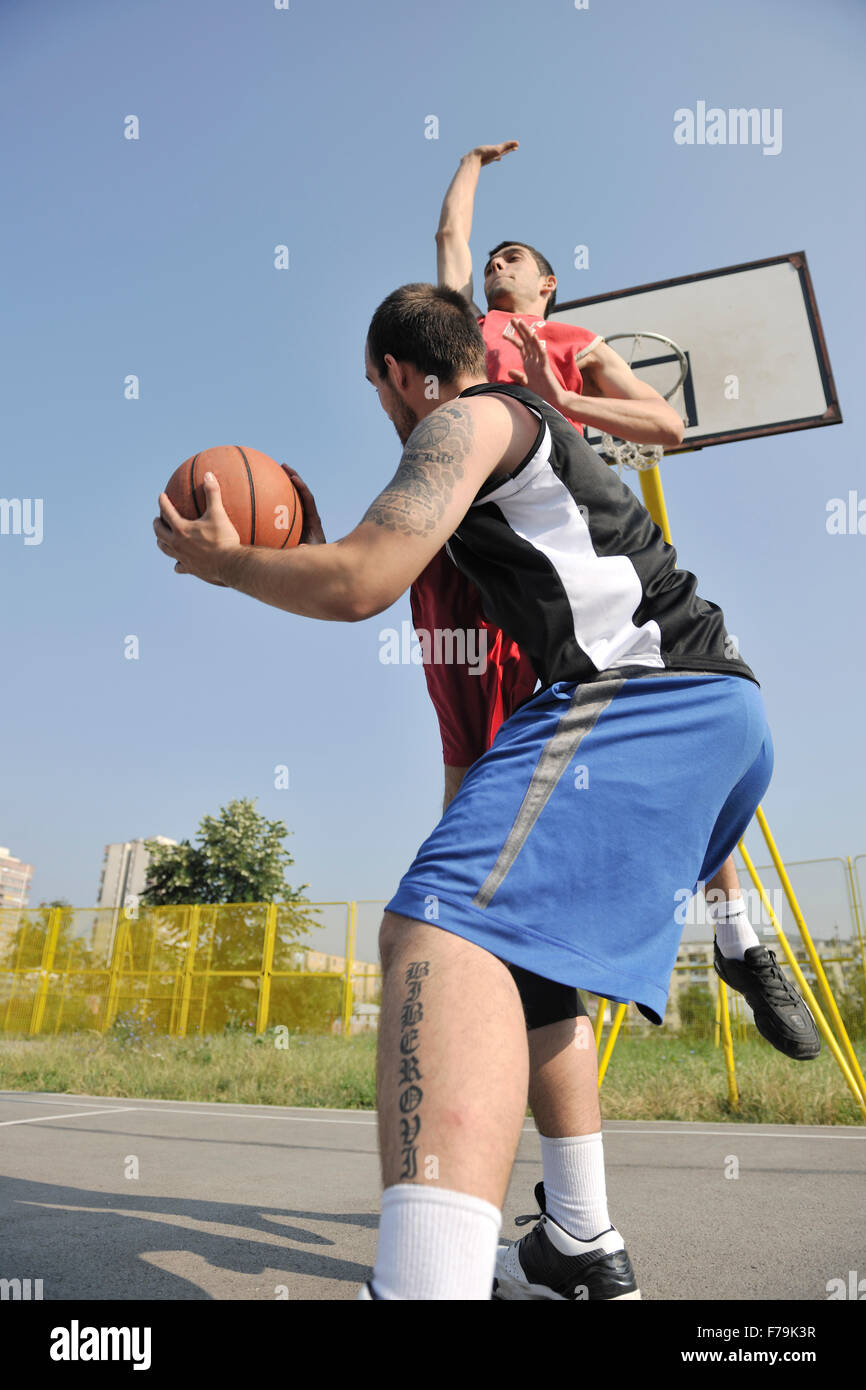 streetball basketball game with two young player at early morning on ...