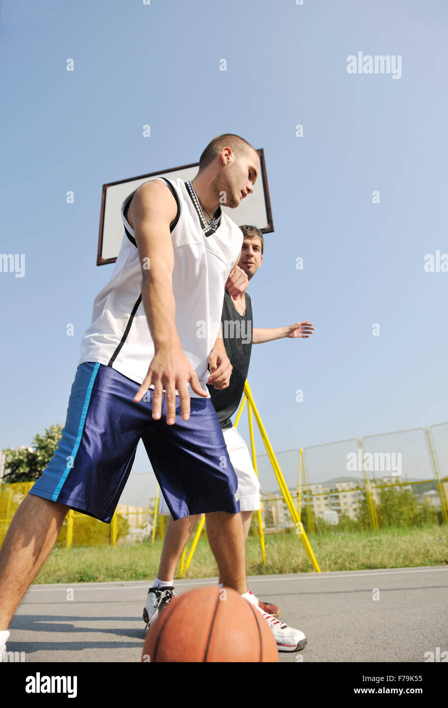streetball basketball game with two young player at early morning on ...