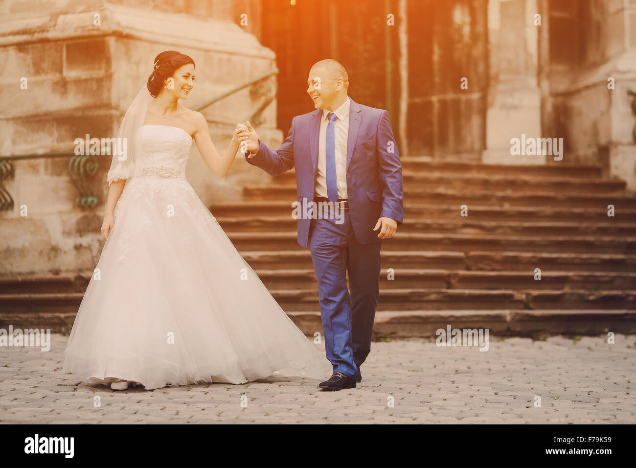 Wedding couple walking Stock Photo - Alamy