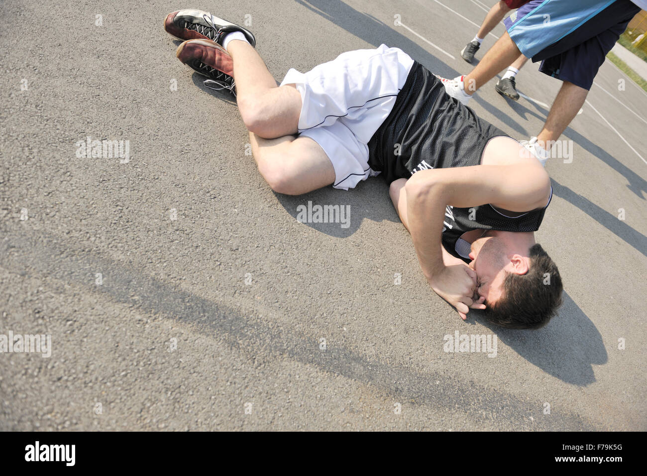 basketball player have foot trauma strech and injury at outdoor ...