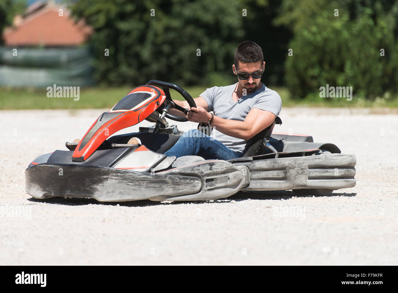 Young Man Is Driving Go-Kart Car With Speed In A Playground Racing ...