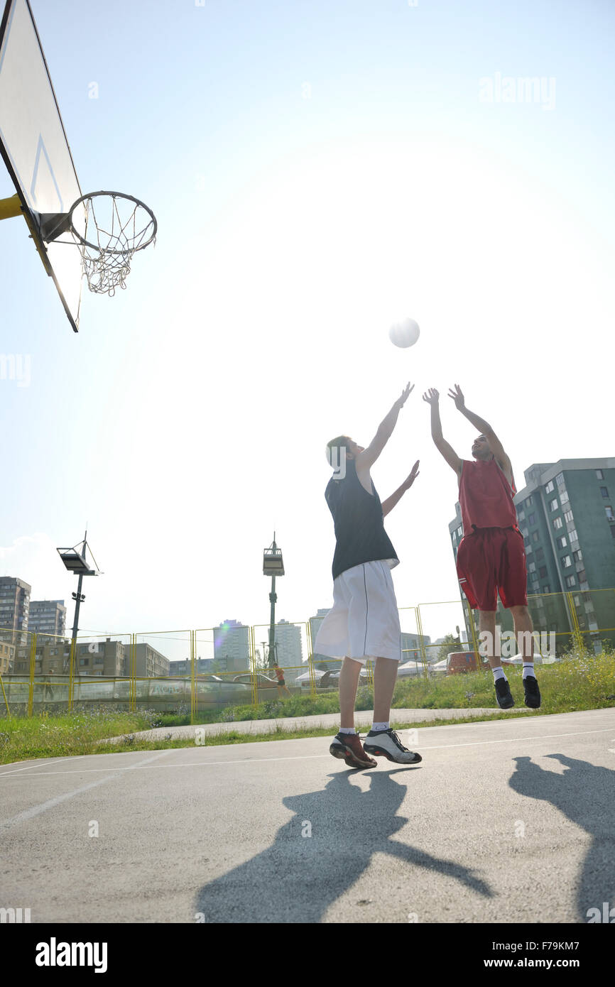 streetball basketball game with two young player at early morning on ...