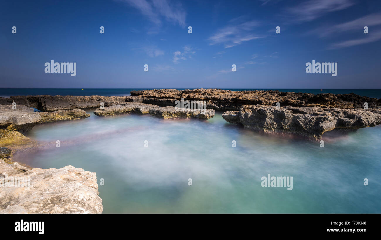 image of the coast of Alicante in Spain with rocks and the ...