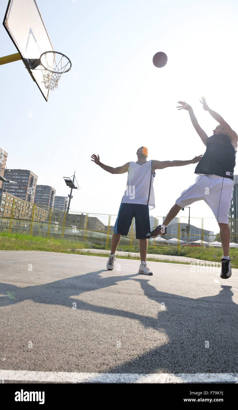 streetball basketball game with two young player at early morning on ...