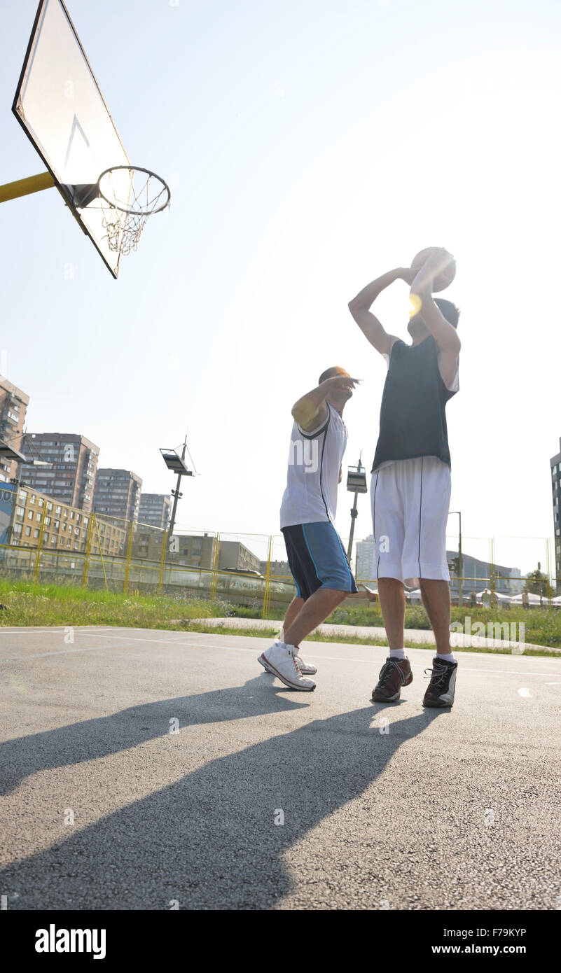 streetball basketball game with two young player at early morning on ...