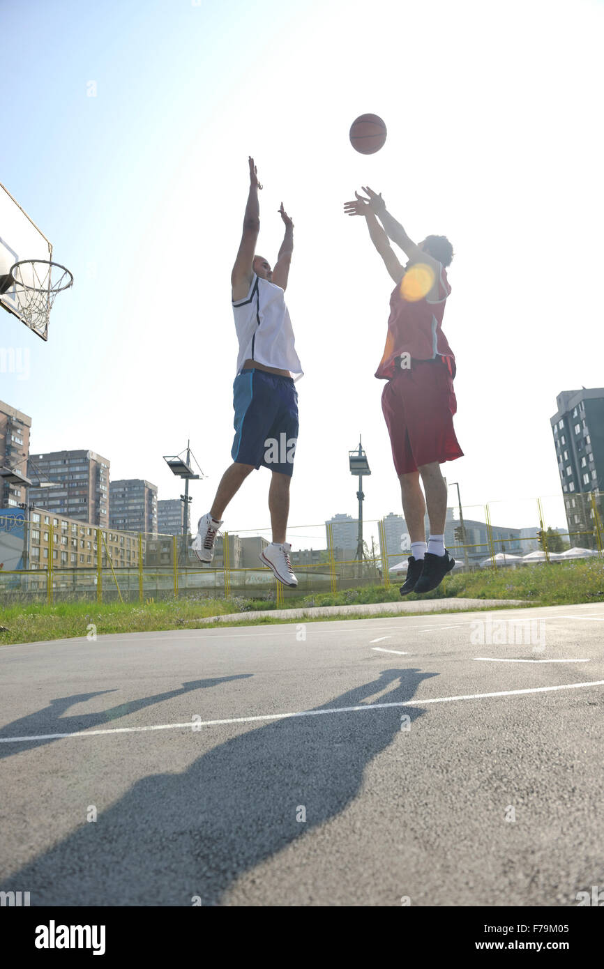 streetball basketball game with two young player at early morning on ...
