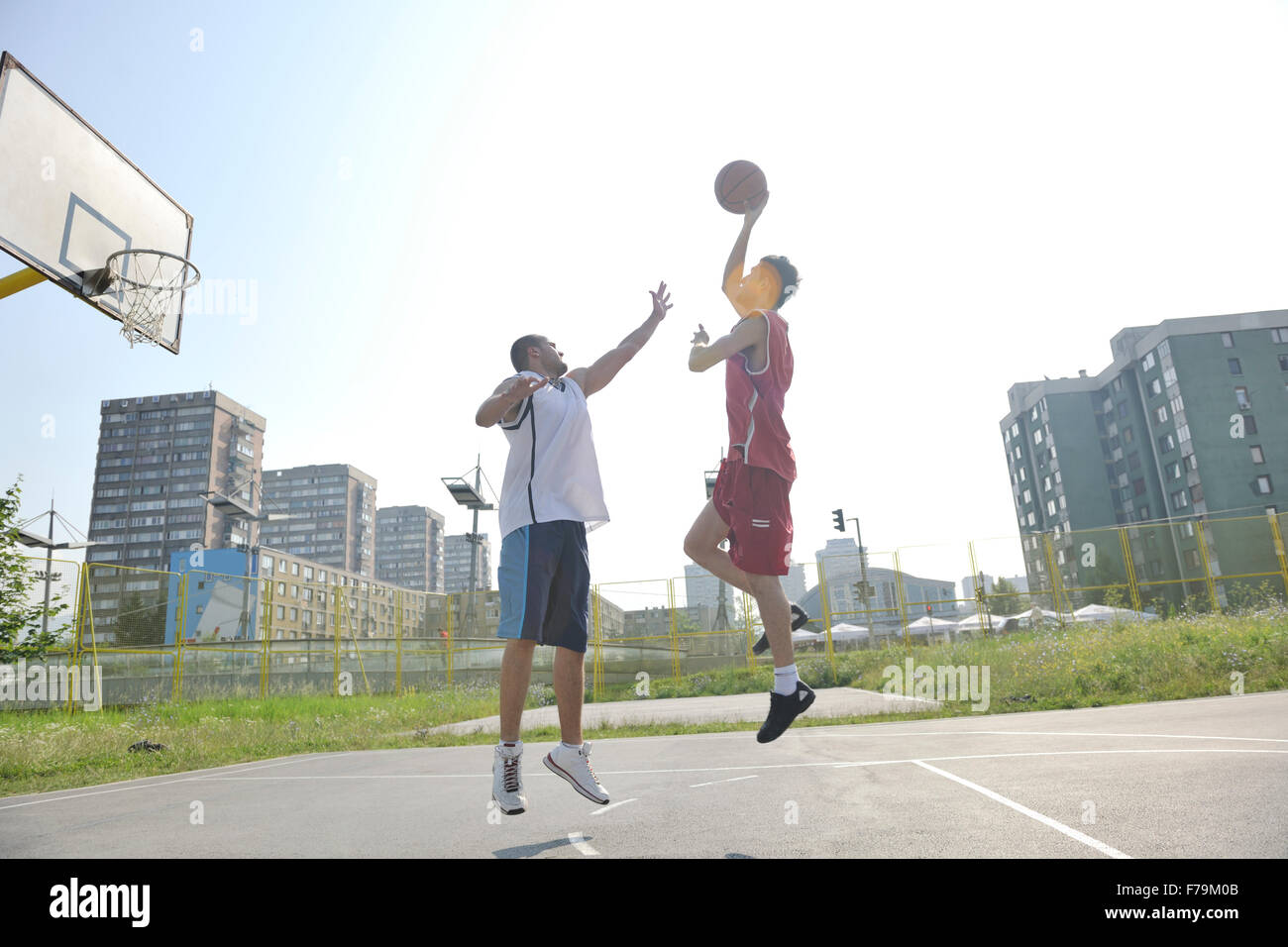 streetball basketball game with two young player at early morning on ...
