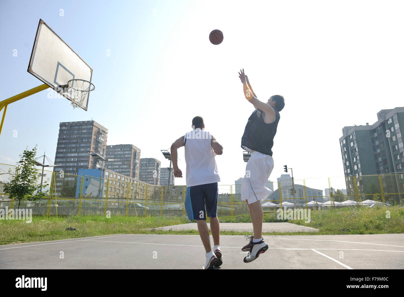 streetball basketball game with two young player at early morning on ...
