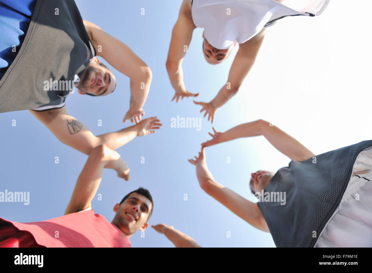 basketball player team group posing on streetbal court at the city on ...
