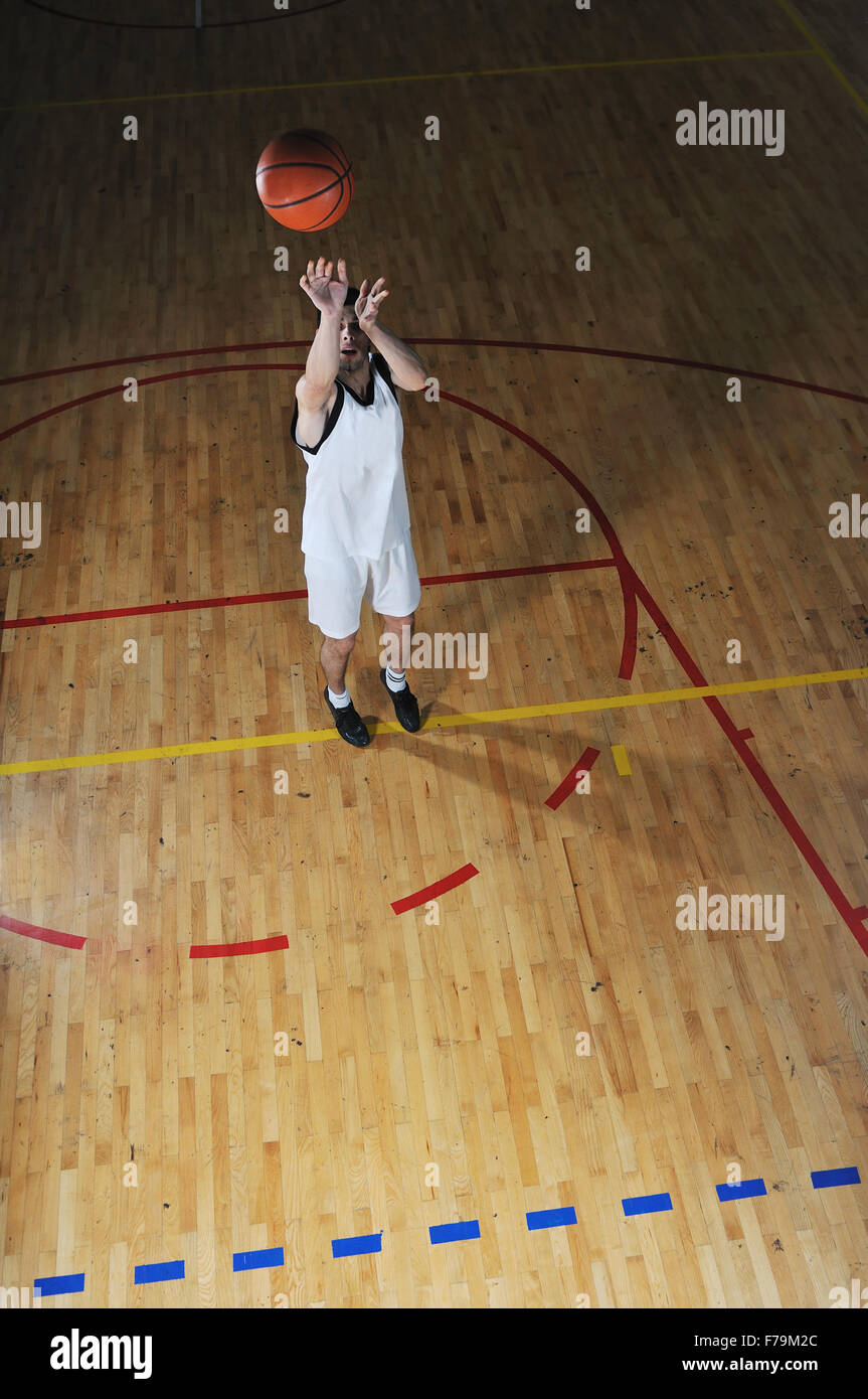 one healthy young man play basketball game in school gym indoor Stock ...