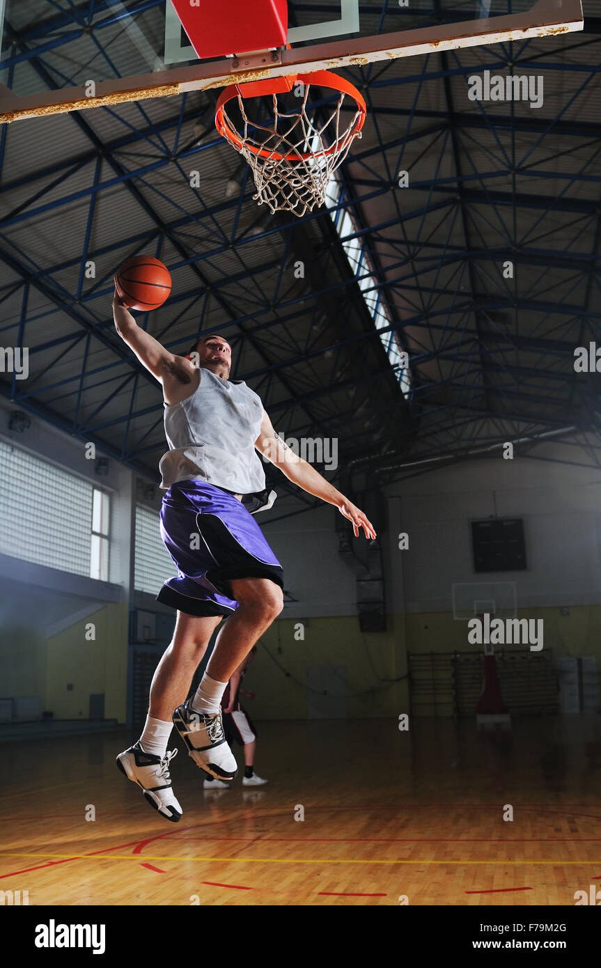 one healthy young man play basketball game in school gym indoor Stock ...