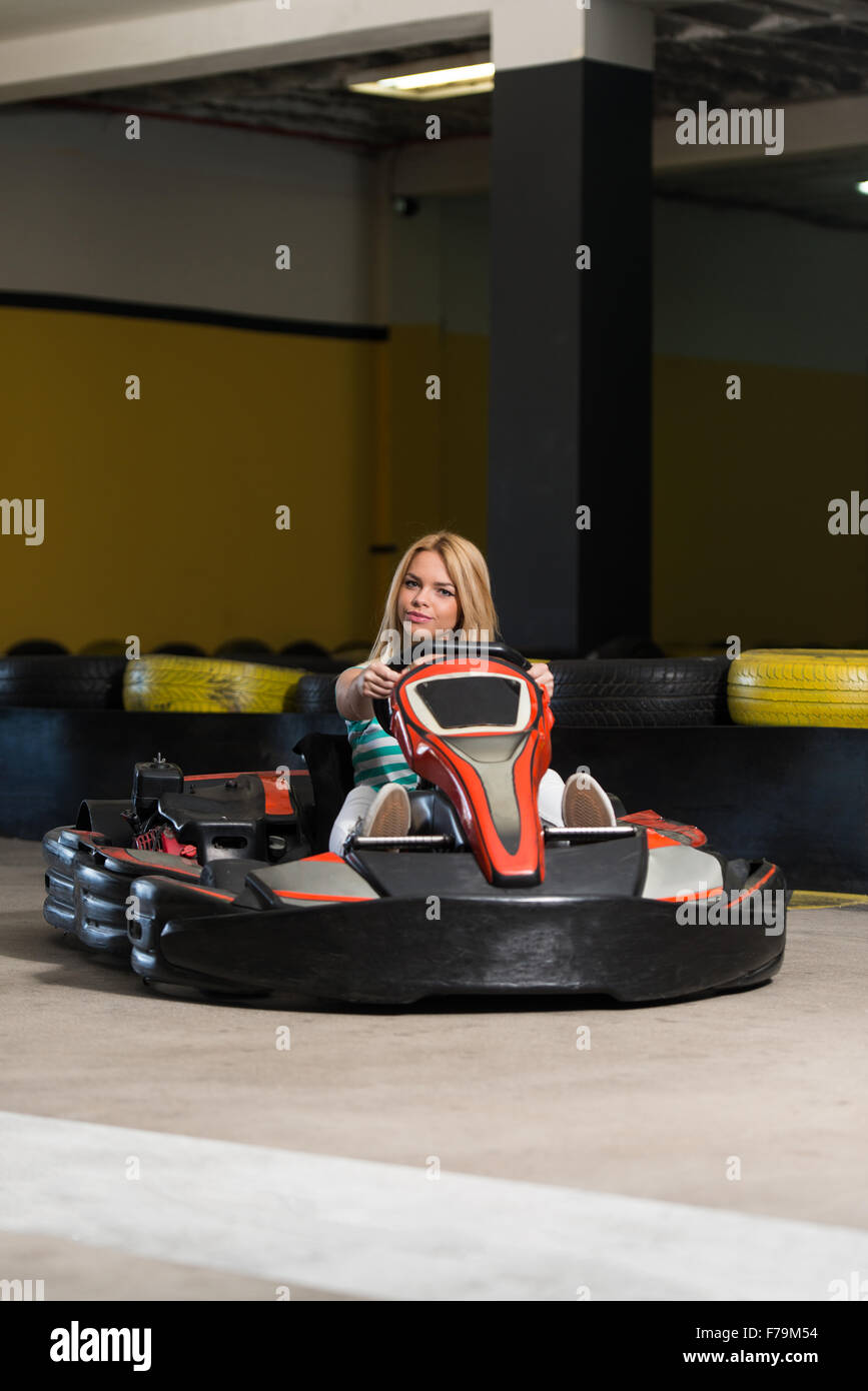 Young Woman Is Driving Go-Kart Car With Speed In A Playground Racing ...