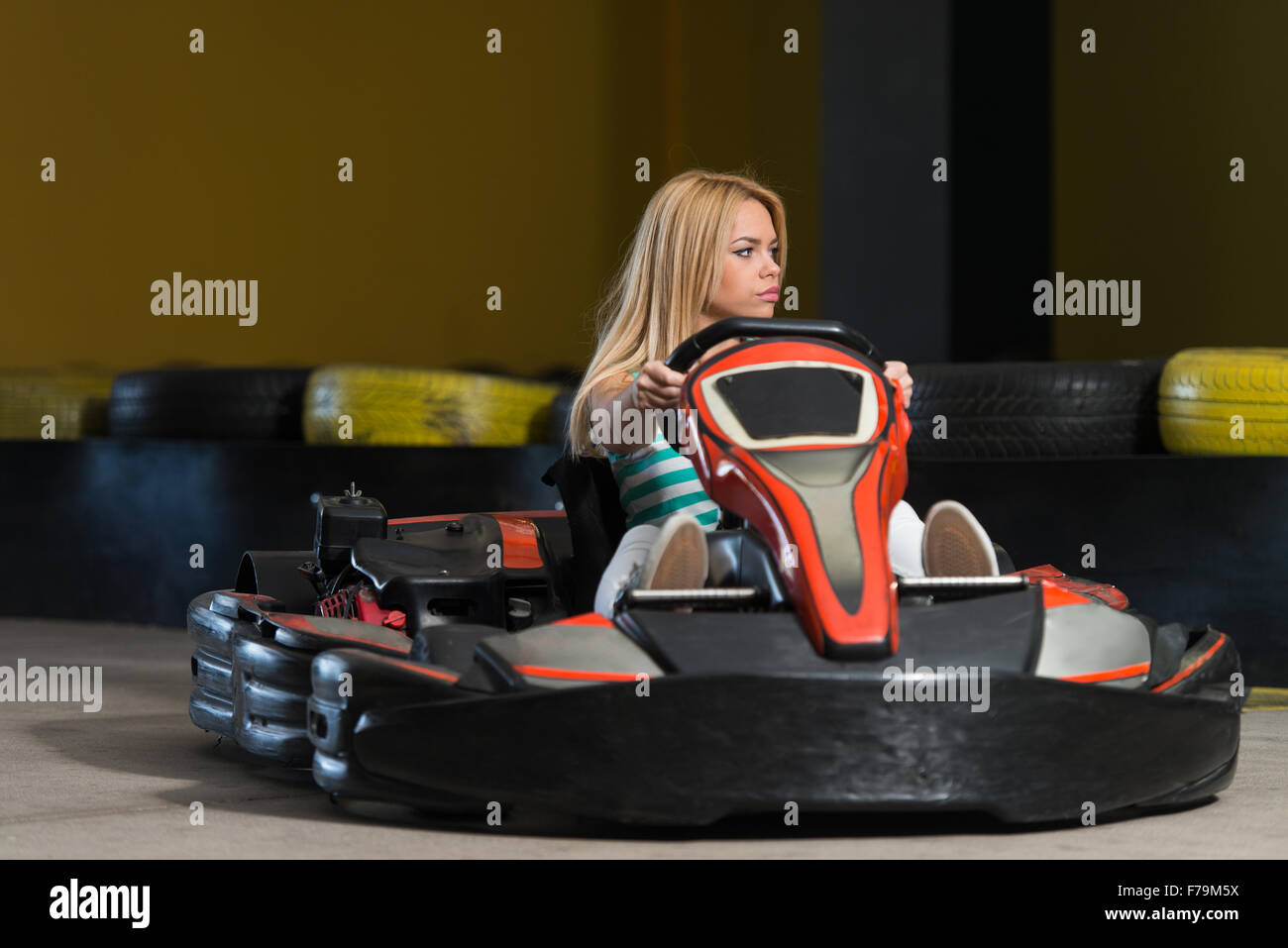 Young Woman Is Driving Go-Kart Car With Speed In A Playground Racing ...