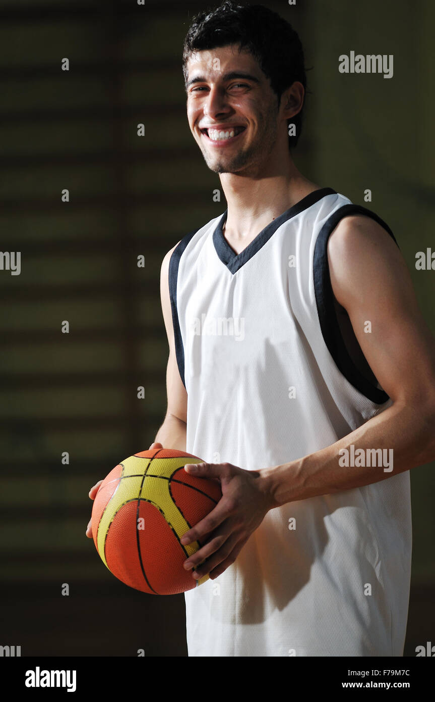 one basket ball game player standing in sport gym with ball Stock Photo ...