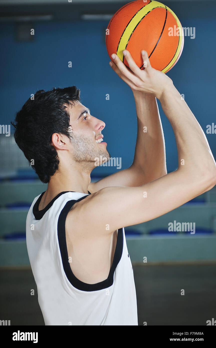 one healthy young man play basketball game in school gym indoor Stock ...