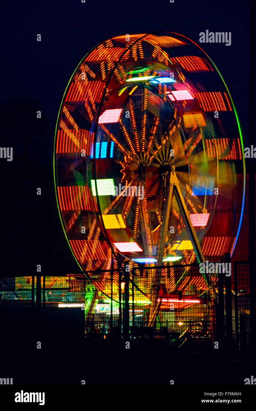 Wind Wheel Carousel at Night Stock Photo - Alamy