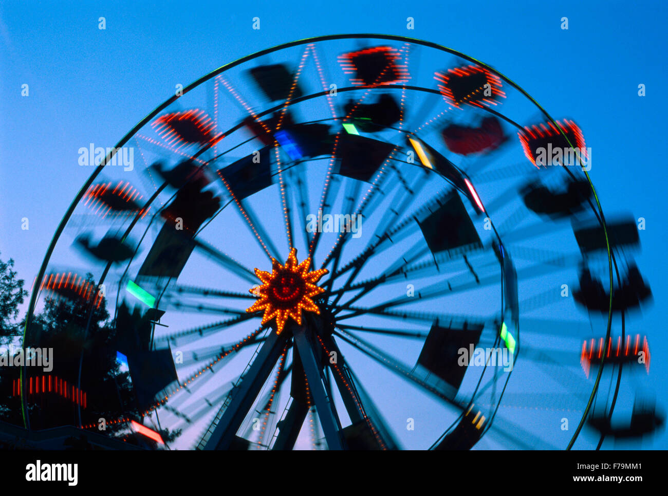 Wind Wheel Carousel at Night Stock Photo - Alamy