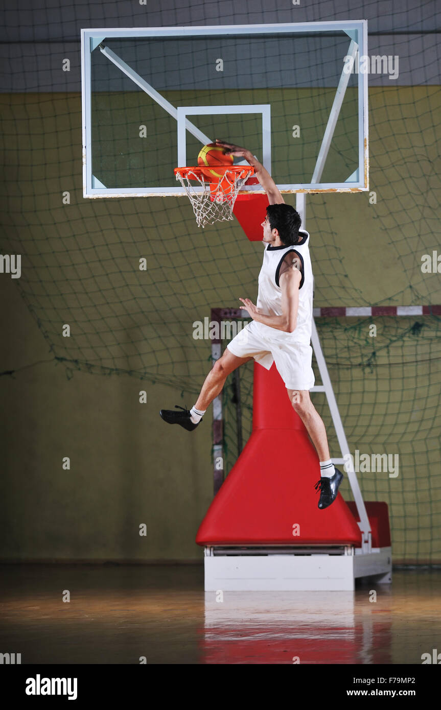 one healthy young man play basketball game in school gym indoor Stock ...