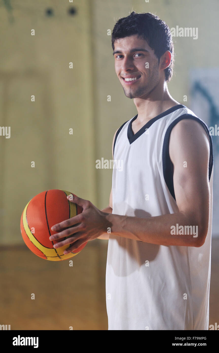one healthy young man play basketball game in school gym indoor Stock ...