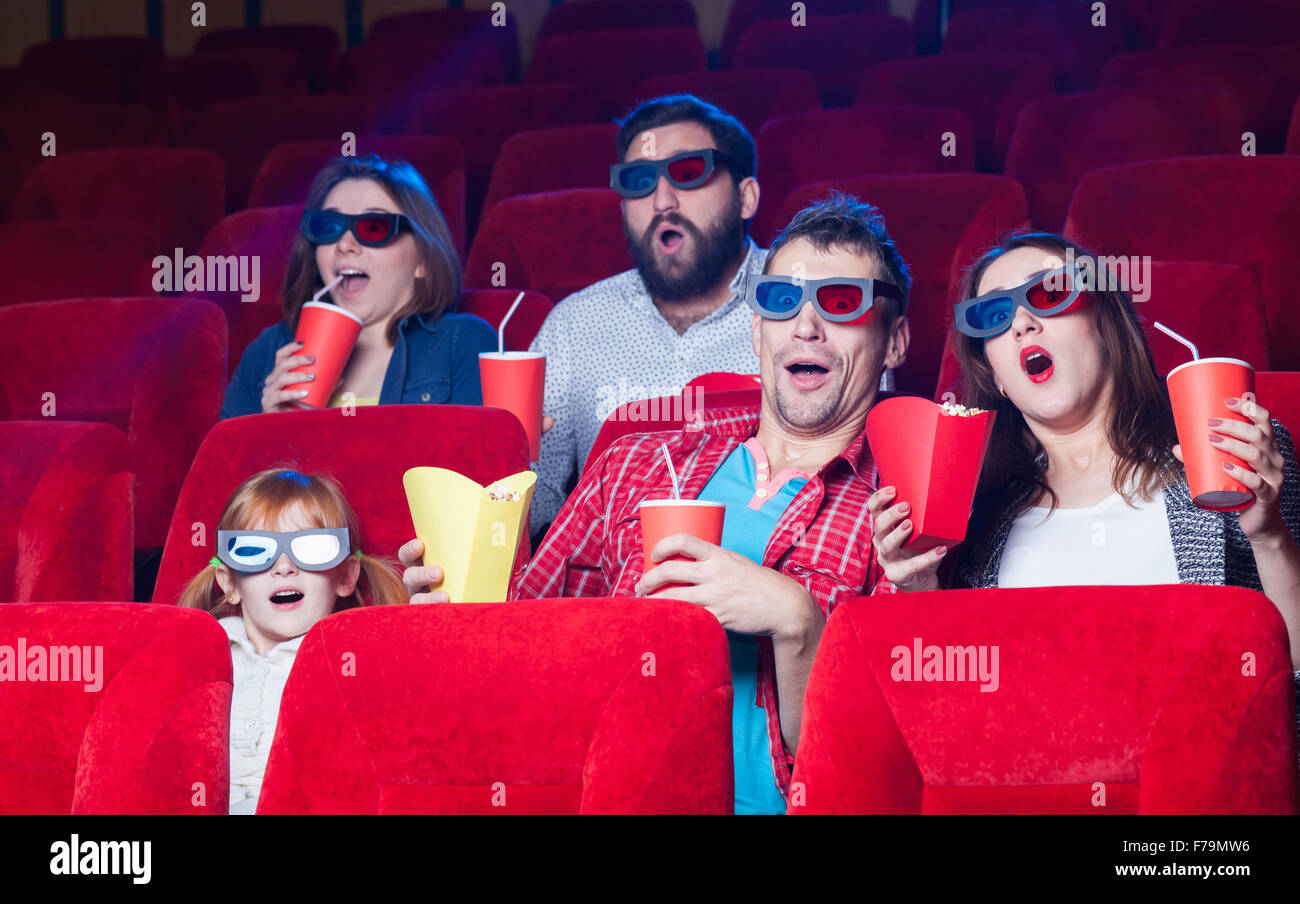 A variety of human emotions of friends holding a cola and popcorn in ...