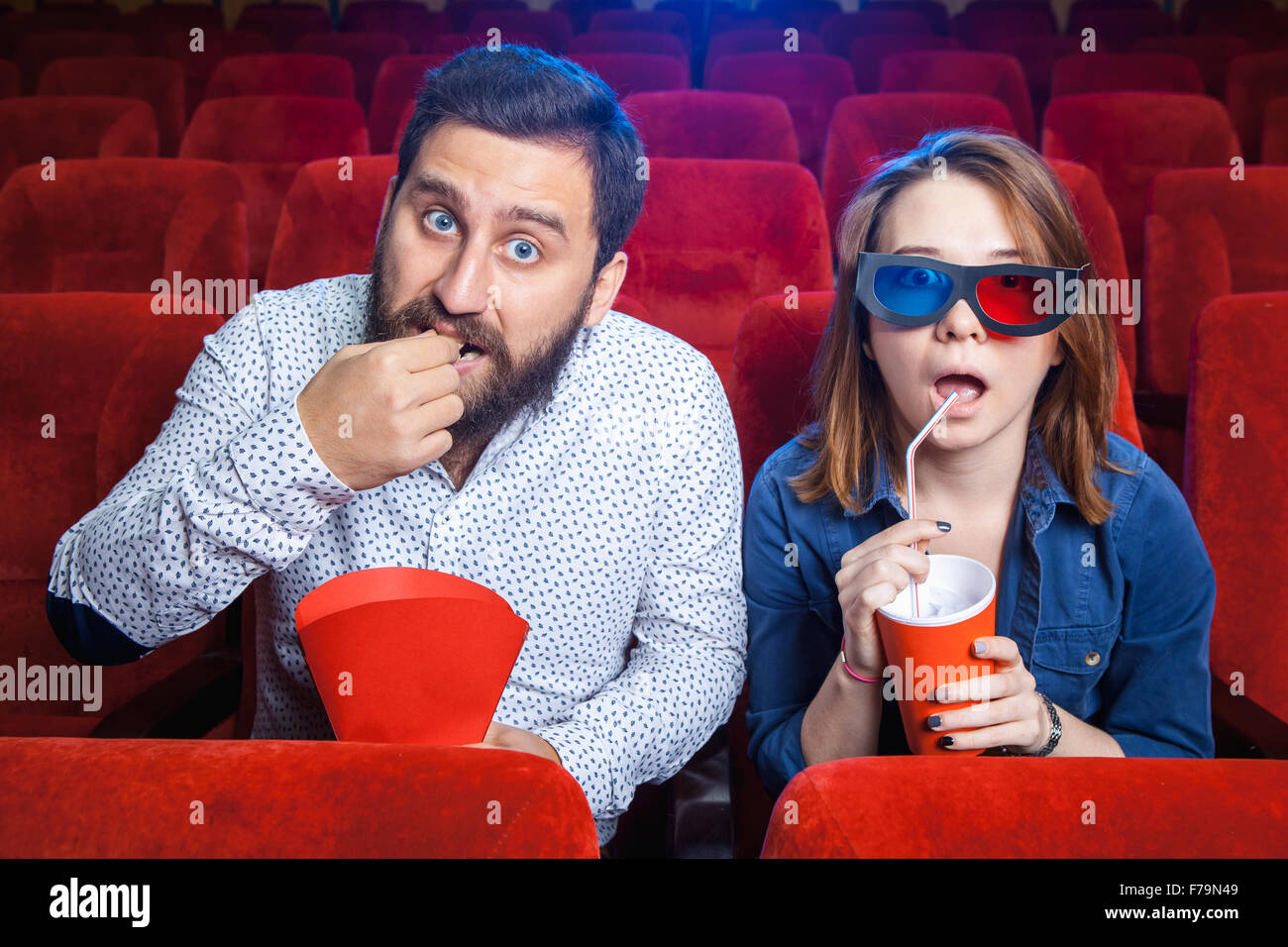 A variety of human emotions of friends holding a cola and popcorn in ...