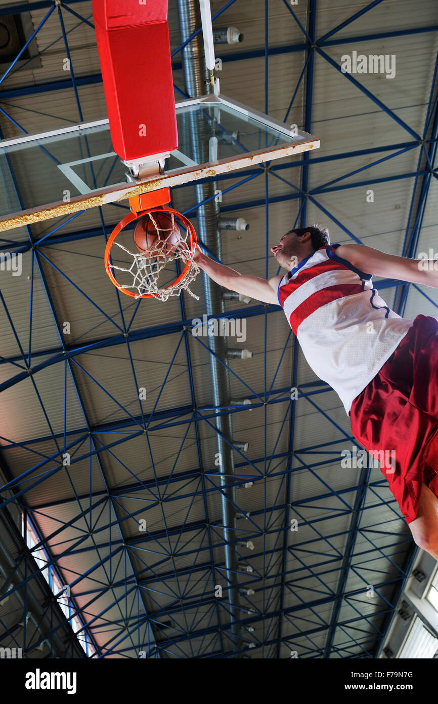 young healthy man play basketball game indoor in gym Stock Photo - Alamy