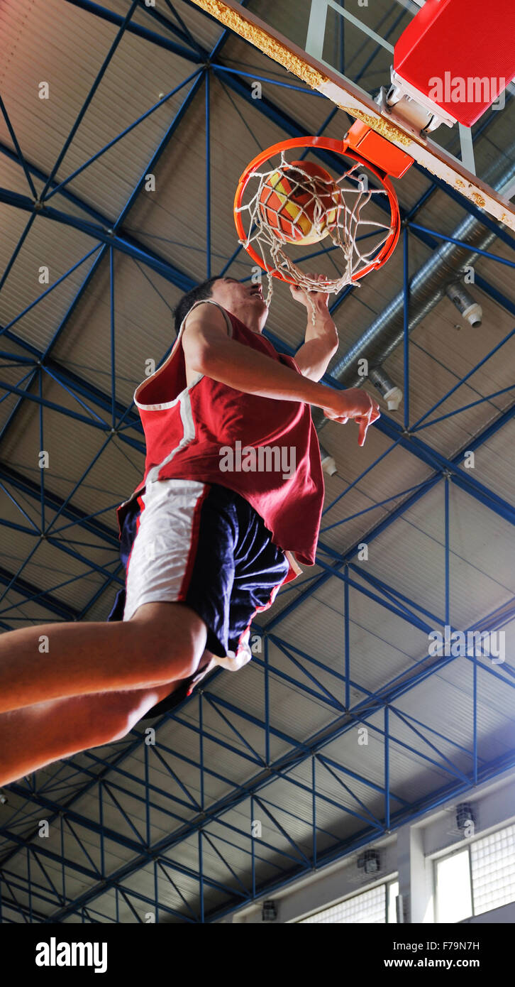 young healthy man play basketball game indoor in gym Stock Photo - Alamy