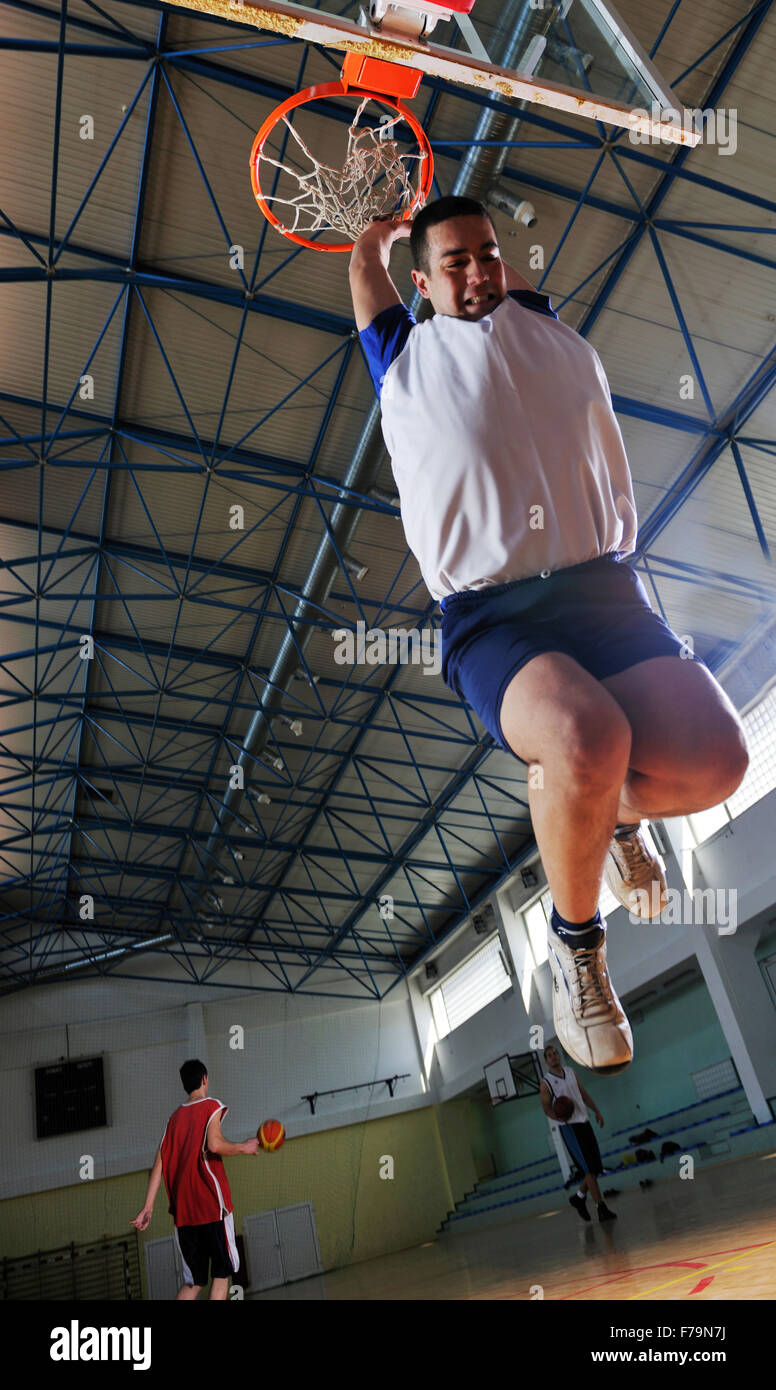 young healthy man play basketball game indoor in gym Stock Photo - Alamy