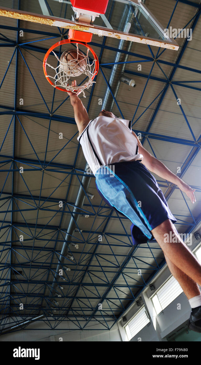 young healthy man play basketball game indoor in gym Stock Photo - Alamy