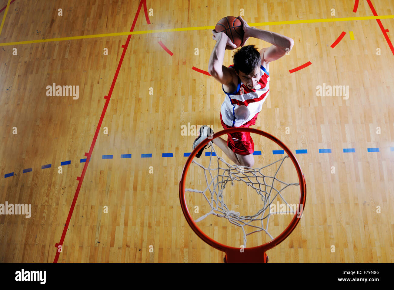 young healthy man play basketball game indoor in gym Stock Photo - Alamy