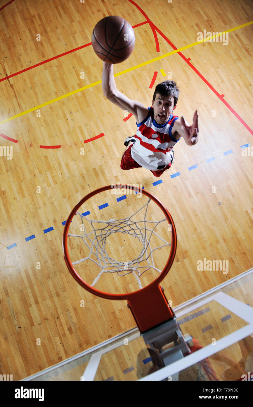 young healthy man play basketball game indoor in gym Stock Photo - Alamy