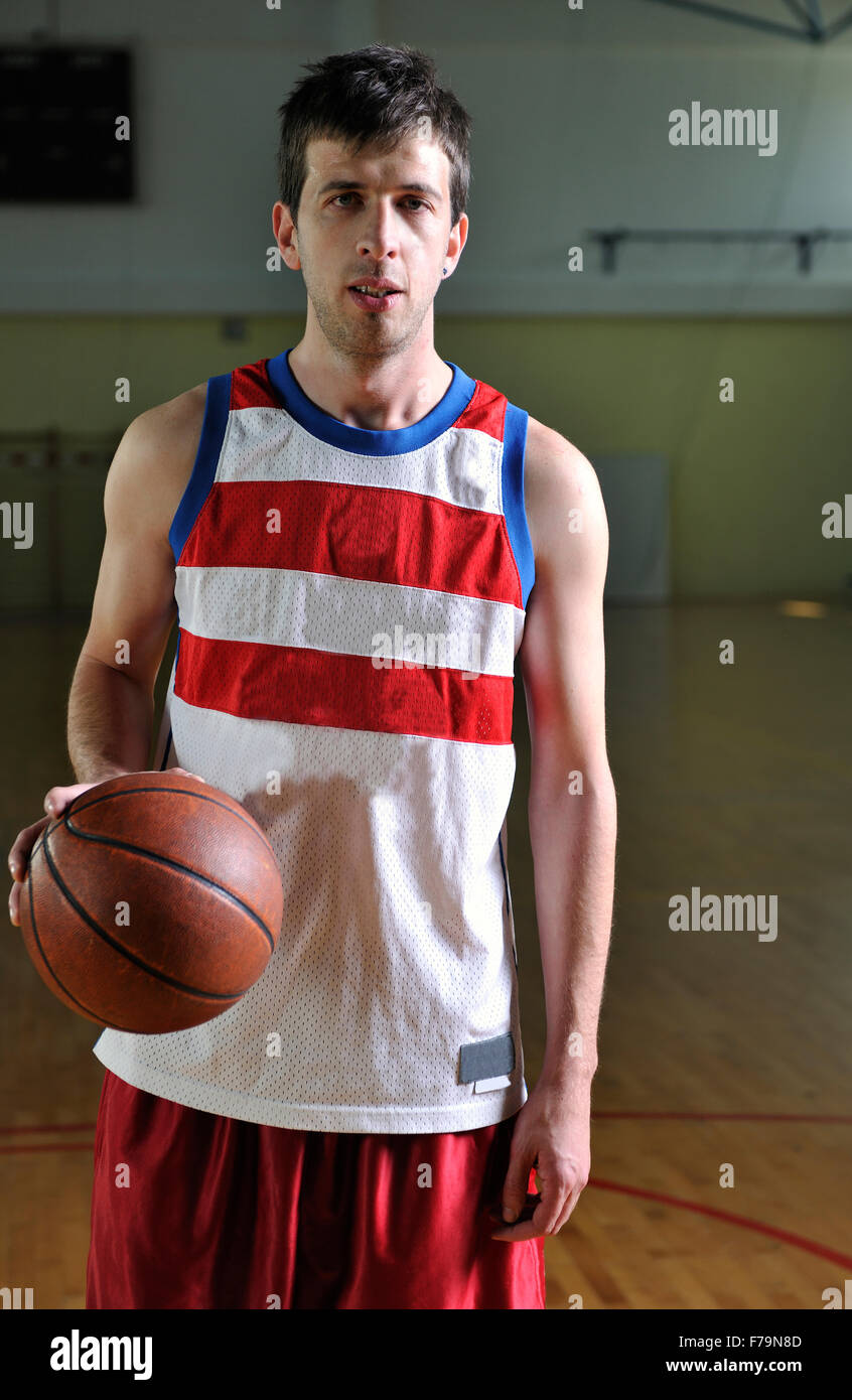 one healthy young man play basketball game in school gym indoor relax ...
