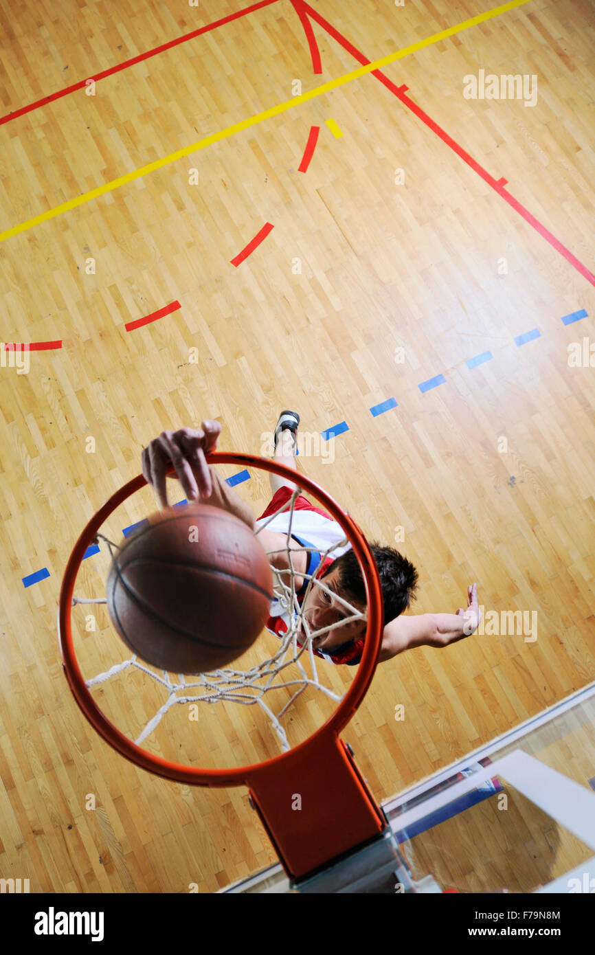 young healthy man play basketball game indoor in gym Stock Photo - Alamy