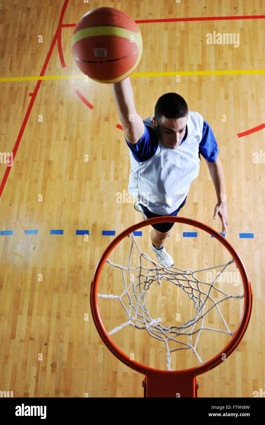 young healthy man play basketball game indoor in gym Stock Photo - Alamy