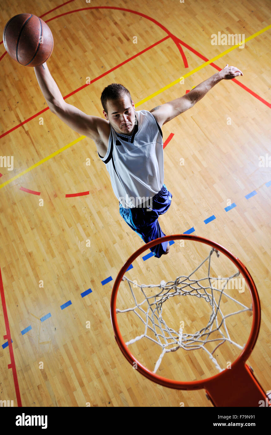 young healthy man play basketball game indoor in gym Stock Photo - Alamy