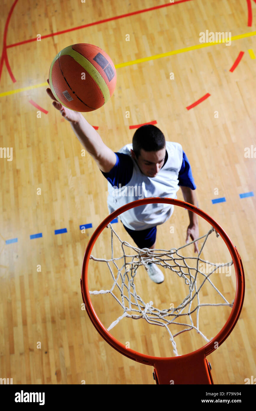 young healthy man play basketball game indoor in gym Stock Photo - Alamy
