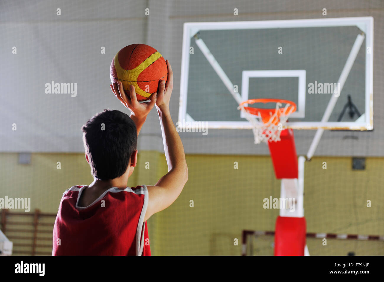 young healthy man play basketball game indoor in gym Stock Photo - Alamy