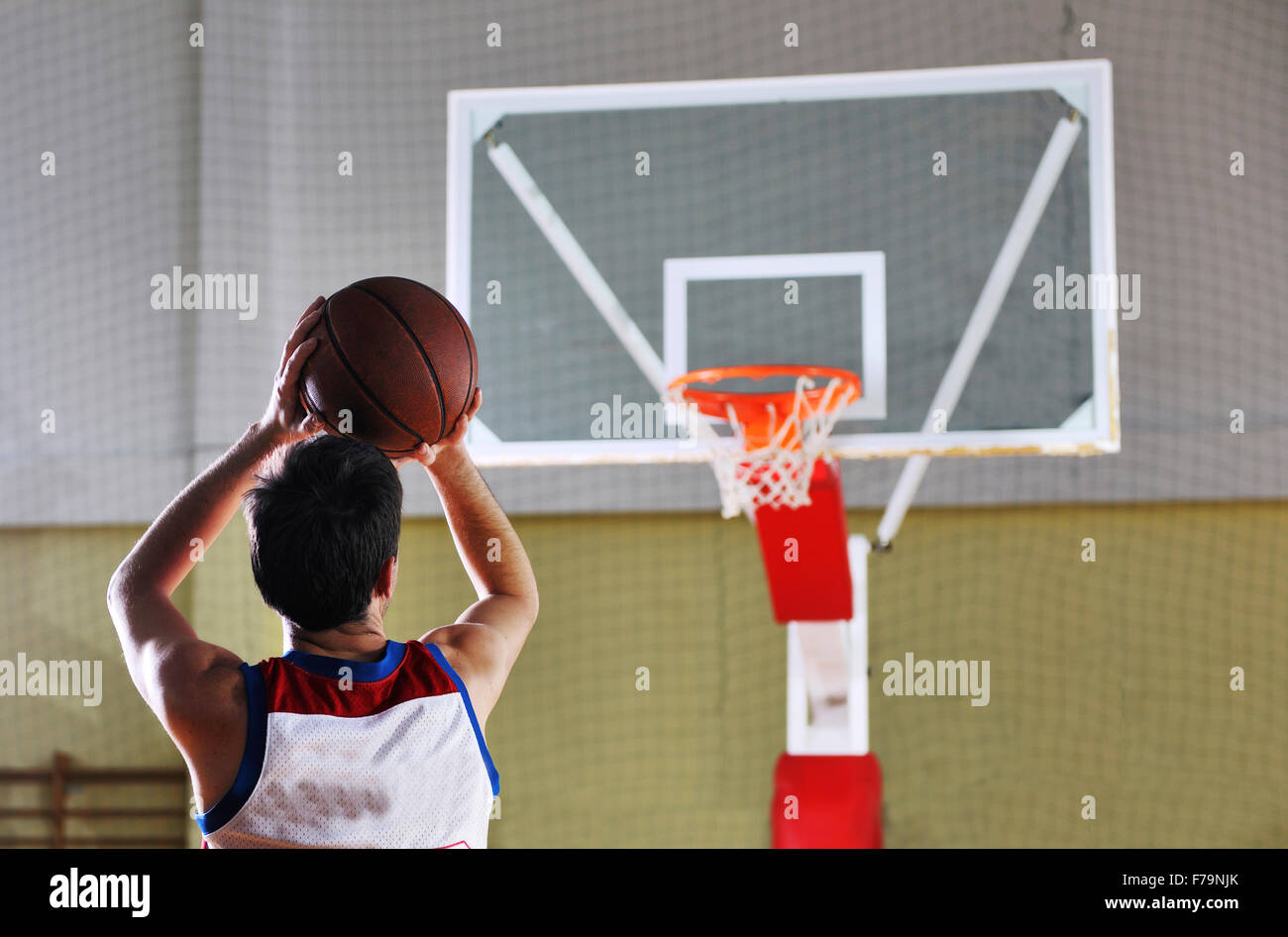 young healthy man play basketball game indoor in gym Stock Photo - Alamy