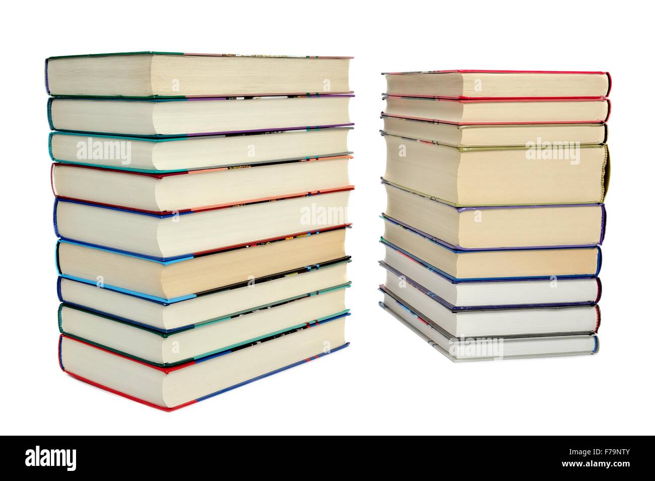Two piles of books on a white background Stock Photo - Alamy
