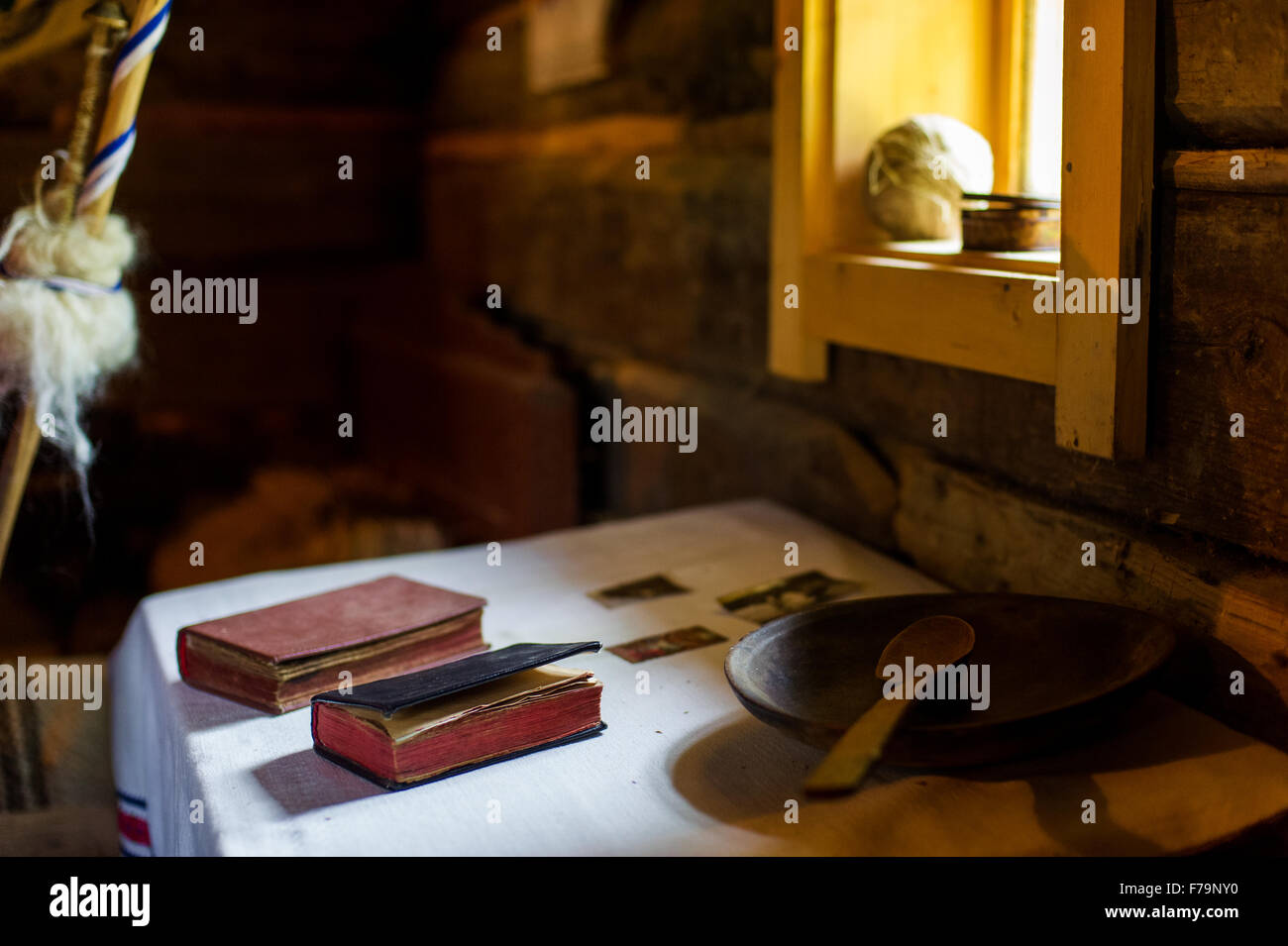 Rural vintage wood kitchen table with books and cooking utensils around ...
