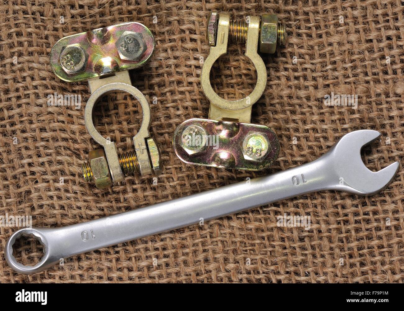 Two battery Terminal Blocks and wrench lay on matting Stock Photo - Alamy