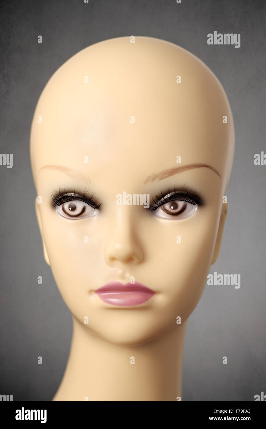 Closeup of a female mannequin head on gray background Stock Photo - Alamy