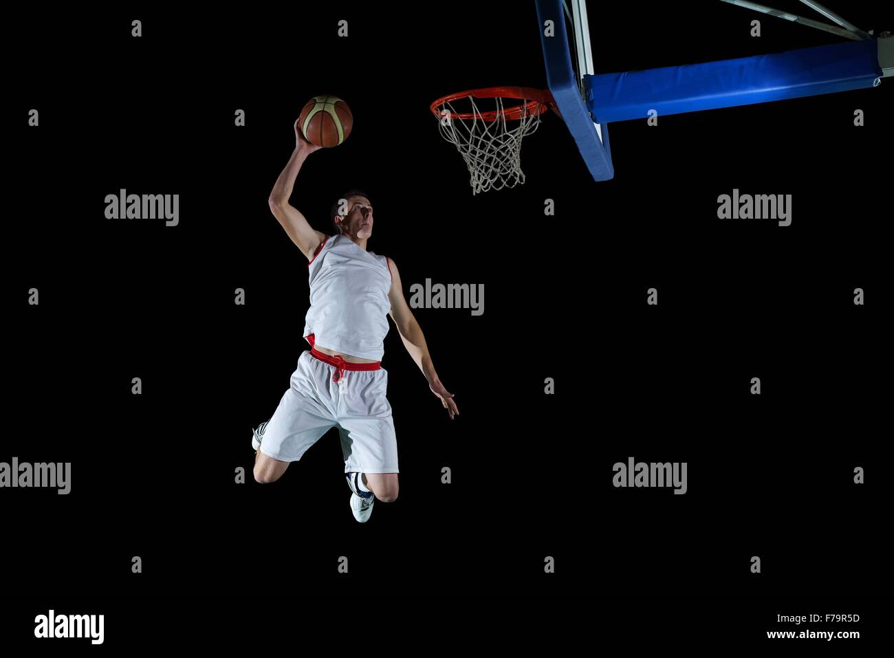 Basketball player jumping action hi-res stock photography and images ...