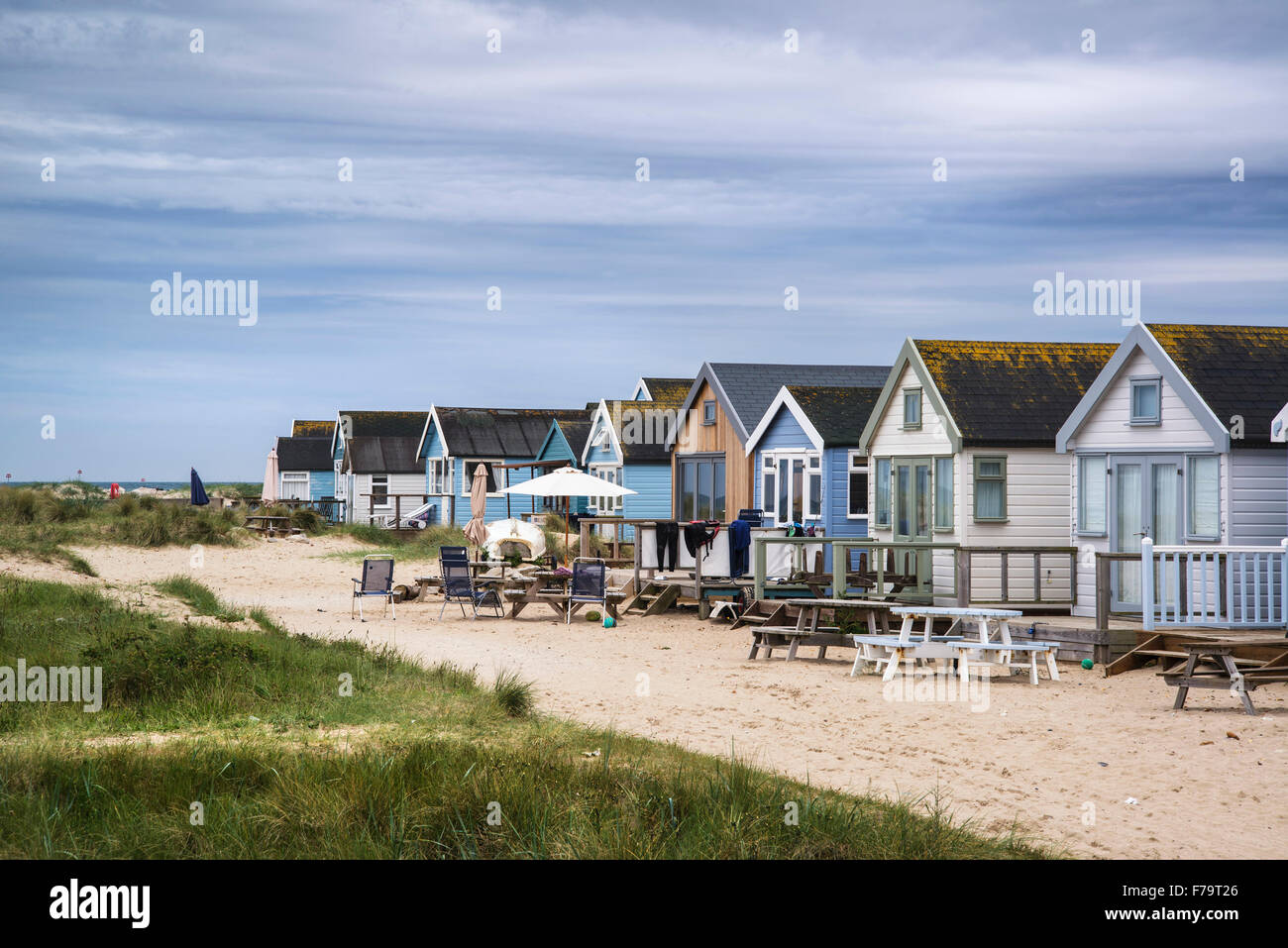 Beach huts on sand dunes and beach landscape Stock Photo - Alamy