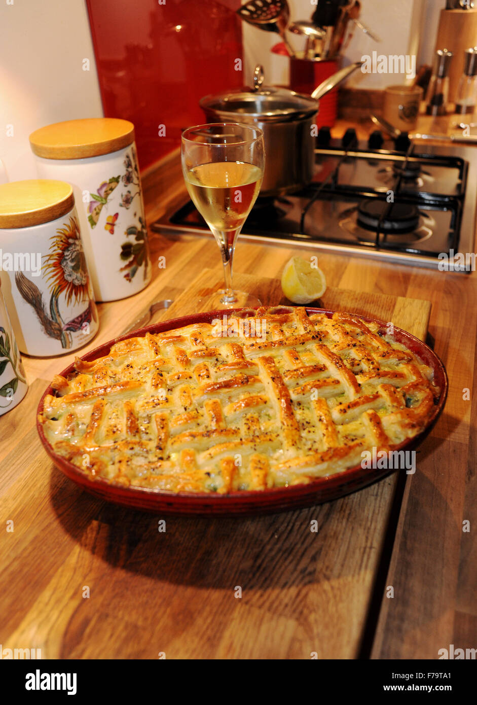 Home made fish pie with a flaky puff pastry lattice topping ready to ...