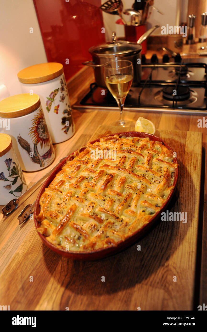 Home made fish pie with a flaky puff pastry lattice topping ready to ...
