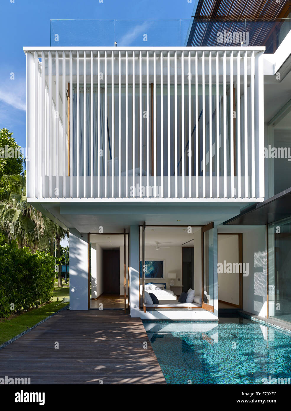 Terrace with shade and pool and the facade of a house in Cove Way ...