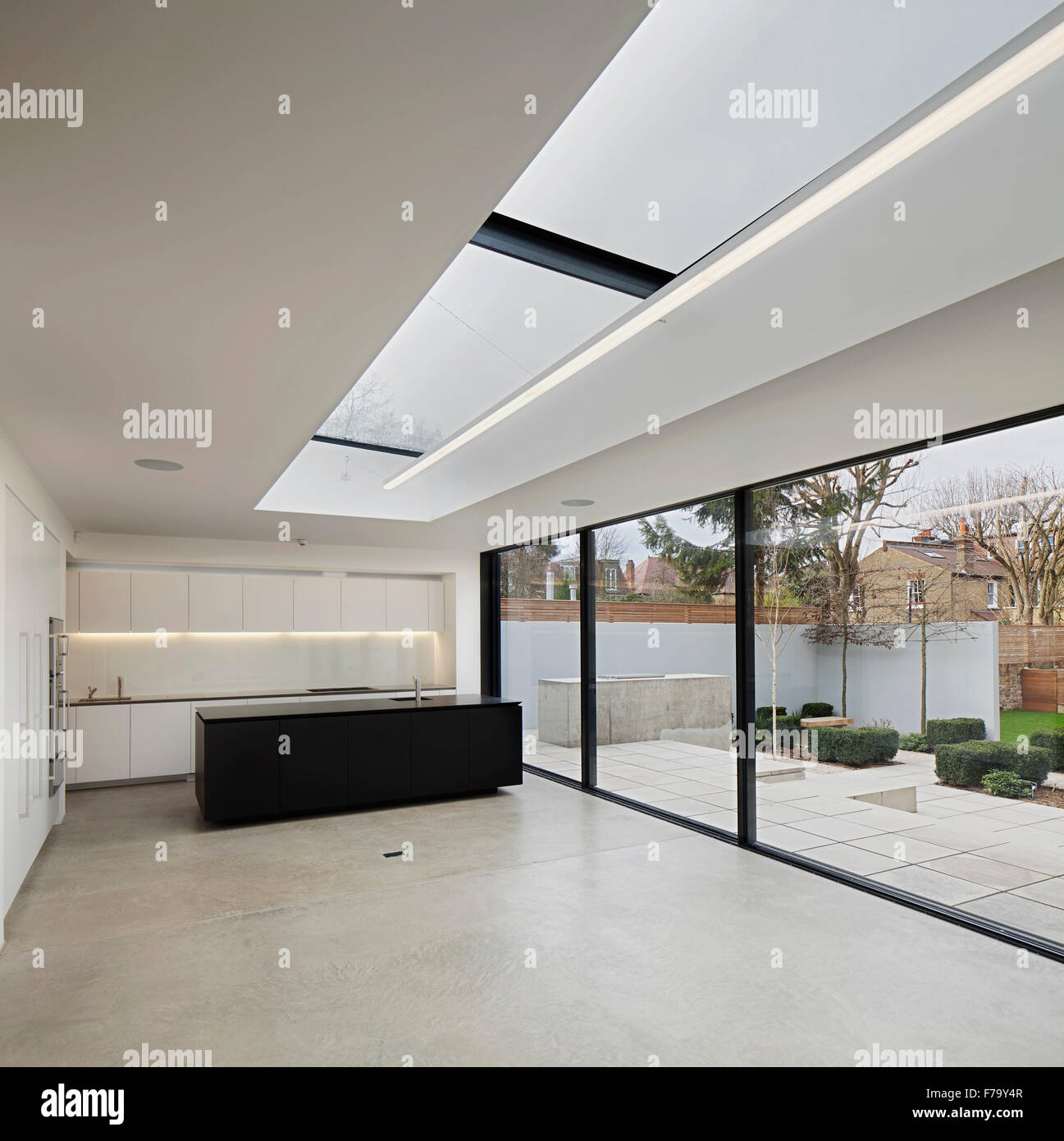 Kitchen with lightwell and view into garden in modern family home 2013 ...